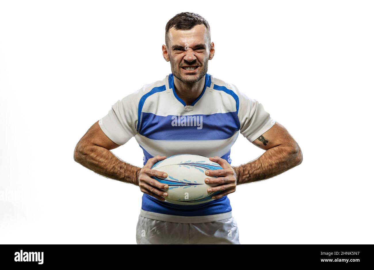 Portrait of serious man, rugby player posing with ball isolated on ...