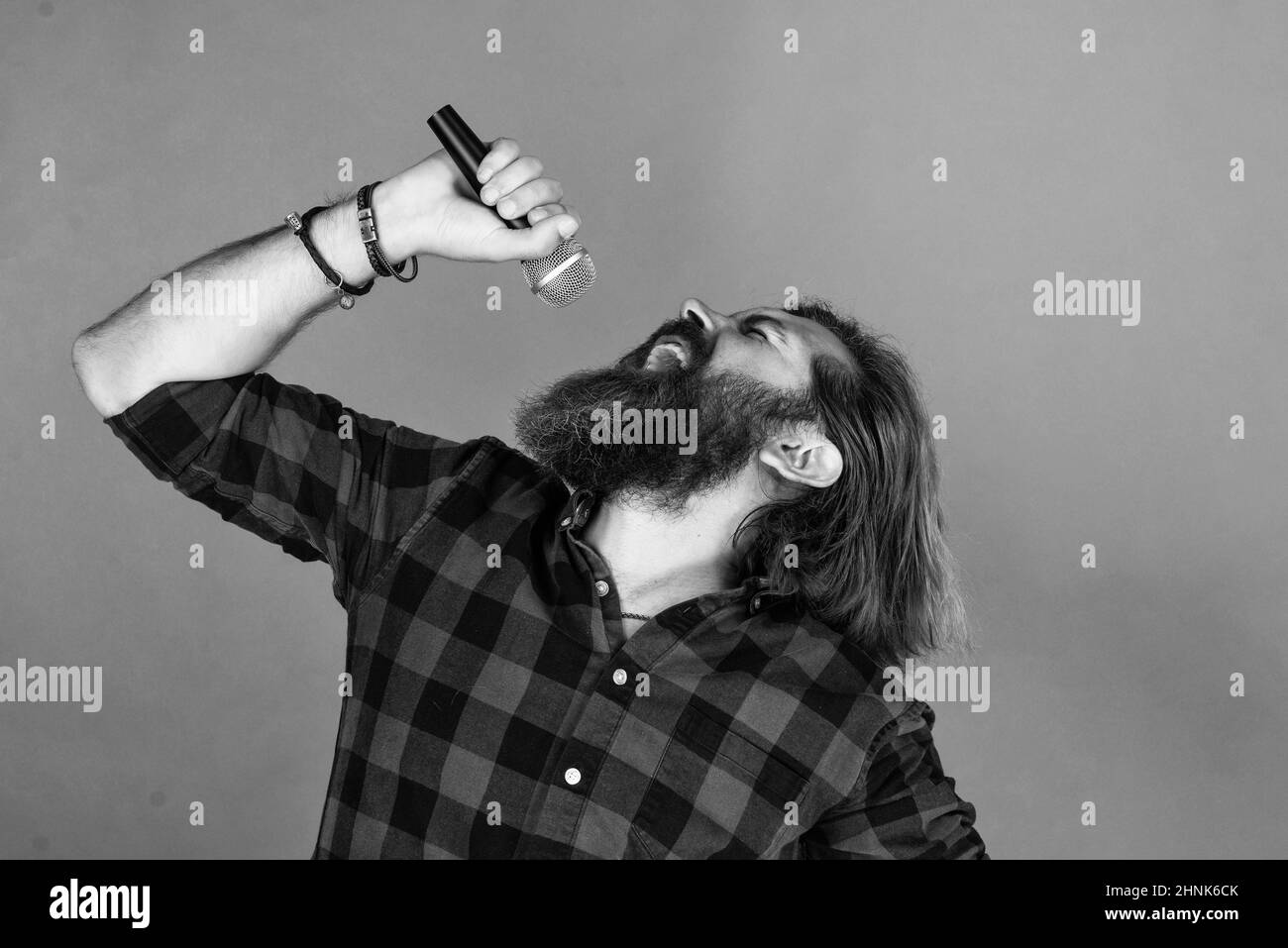 high tune. concept of karaoke. man singer love music. brutal man sing ...