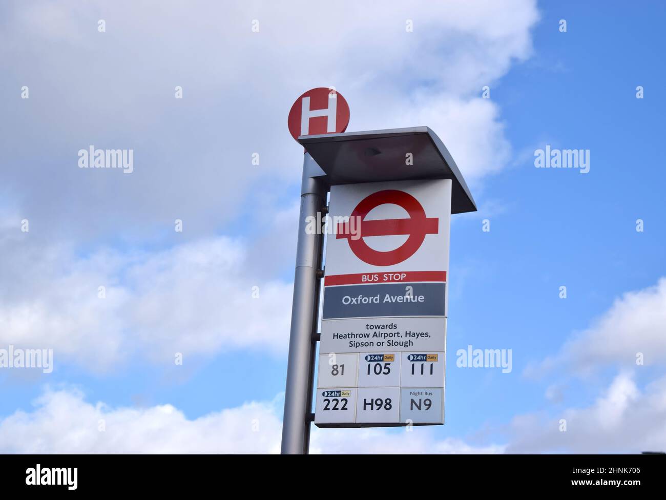 London Oxford Avenue bus stop sign on blue sky background Stock Photo ...