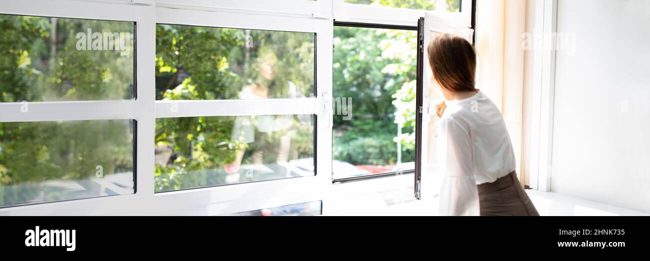 Fresh Air From Window. Side View Of Woman Breathing Stock Photo - Alamy
