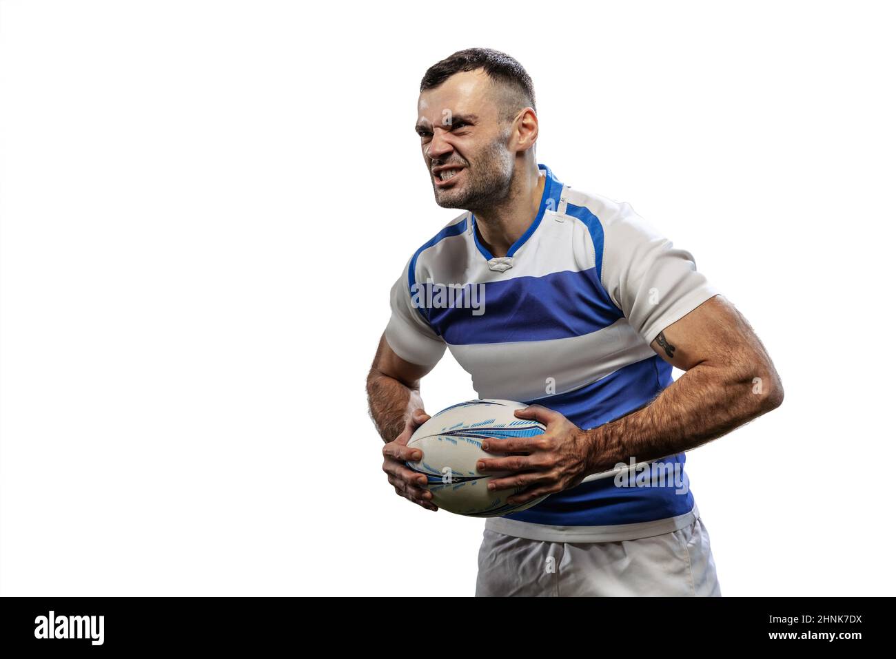 Portrait of serious man, rugby player posing with ball isolated on ...
