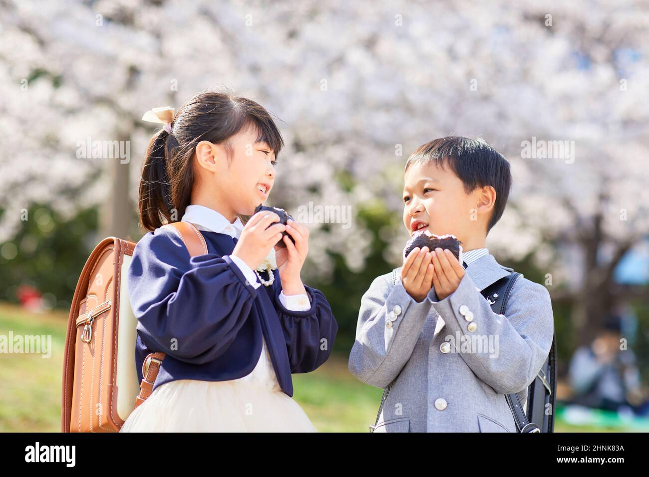 Girl eating rice ball hi-res stock photography and images - Alamy