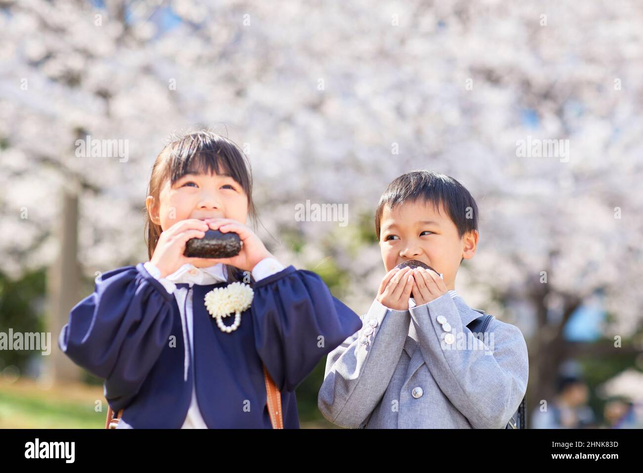 Girl eating rice ball hi-res stock photography and images - Alamy