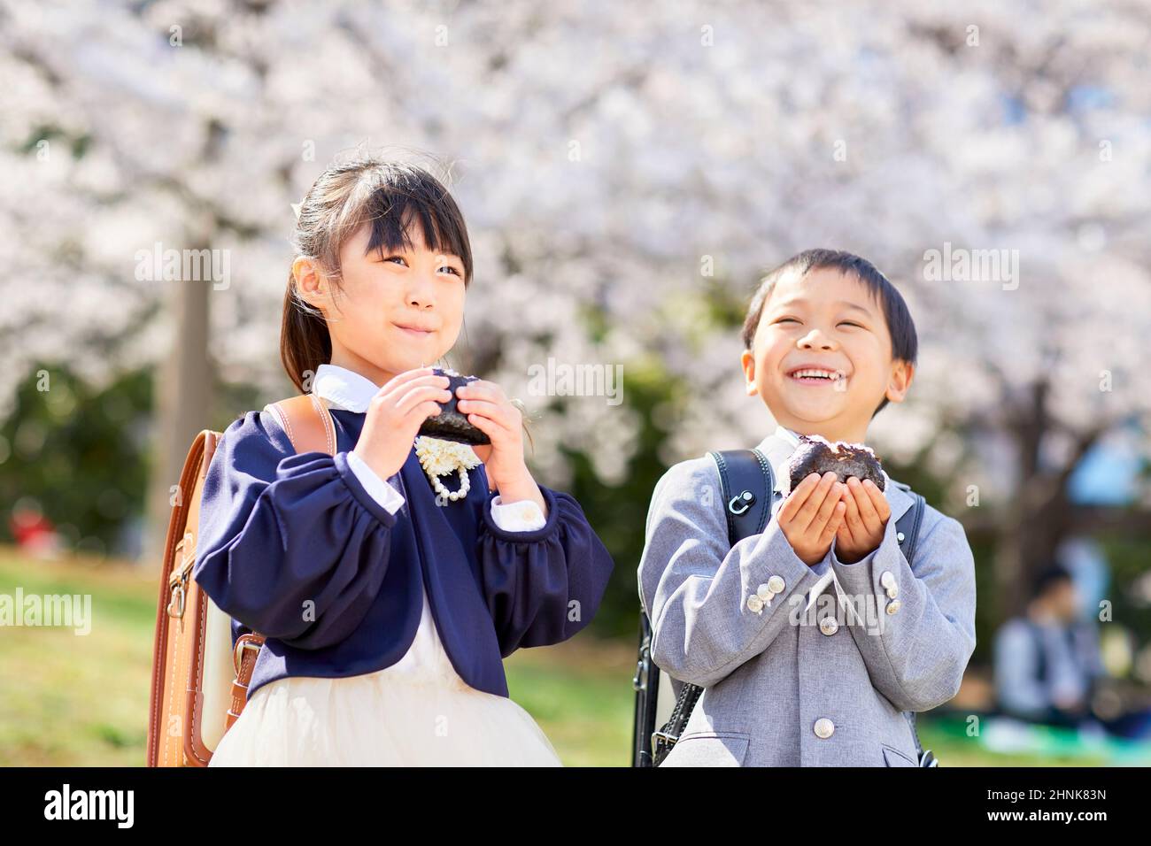 Japanese Elementary School Student Eating A Rice Ball Stock Photo - Alamy
