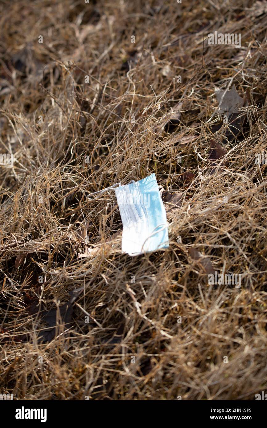 Mask Litter on the Ground Stock Photo - Alamy