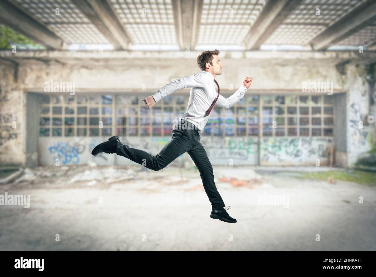businessman running and jumping Stock Photo - Alamy