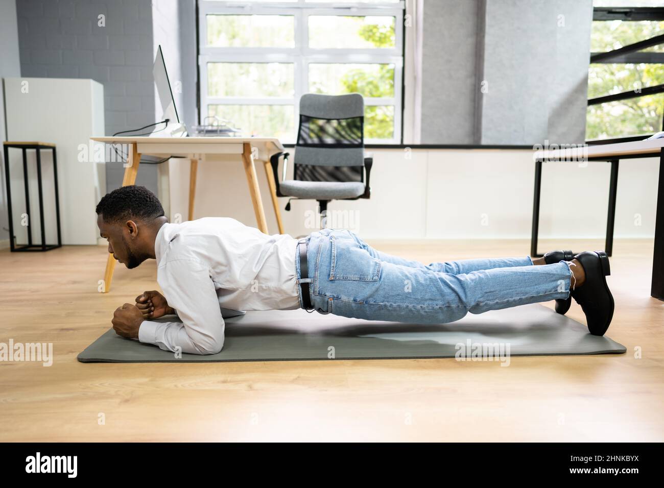 African American Doing Office Exercise Workout Training Stock Photo - Alamy