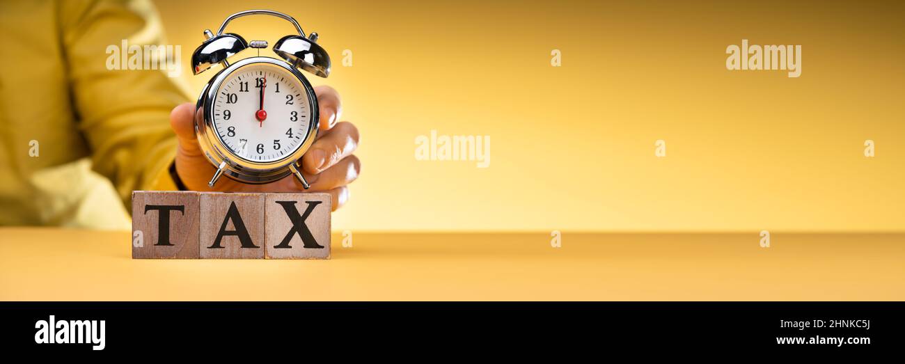 Taxation desk time clock hi-res stock photography and images - Alamy
