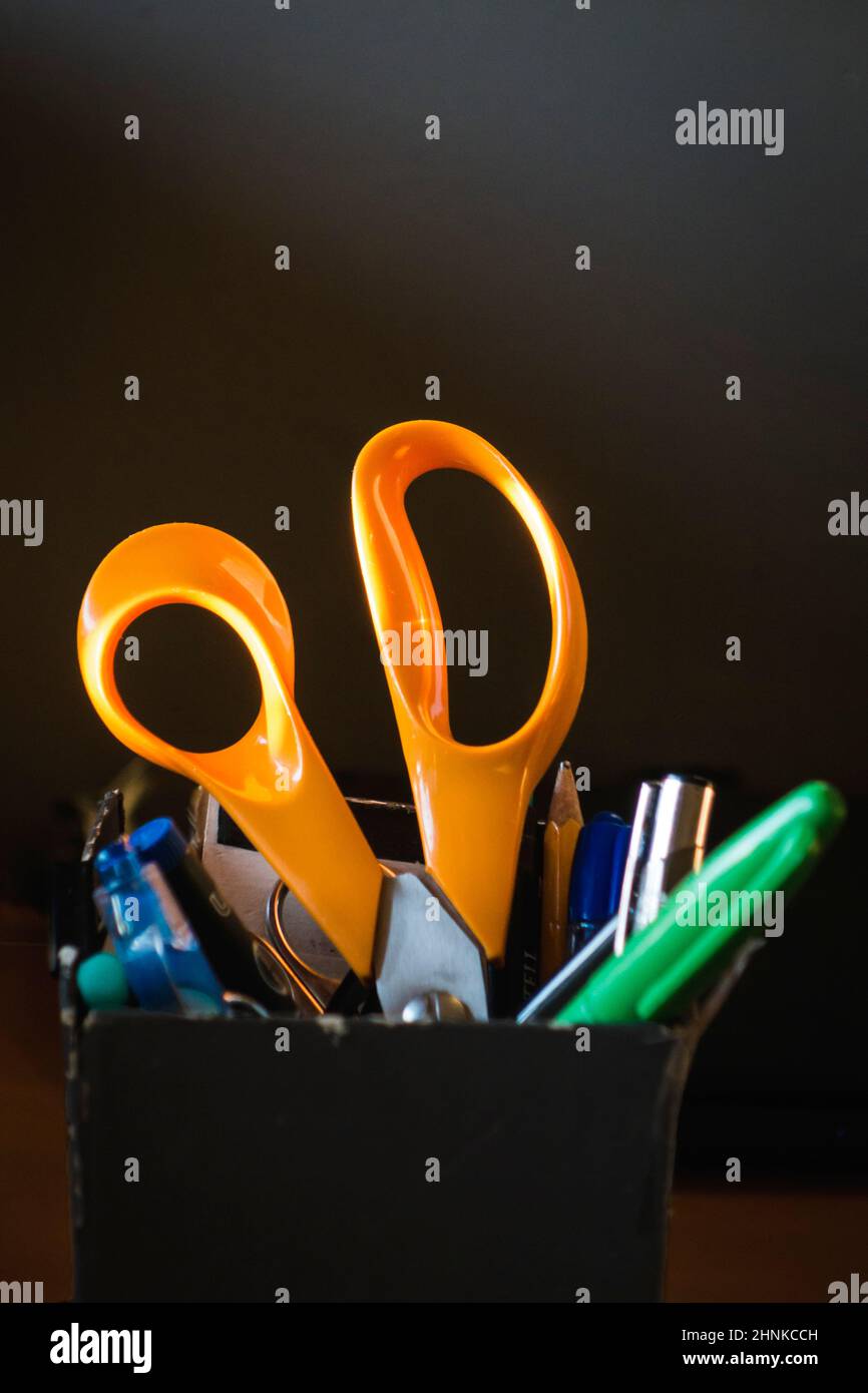 Home office with Scissors And Pencils In box Stock Photo - Alamy