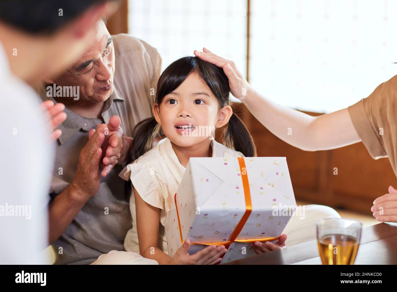 Japanese Girl Receiving A Present Stock Photo - Alamy