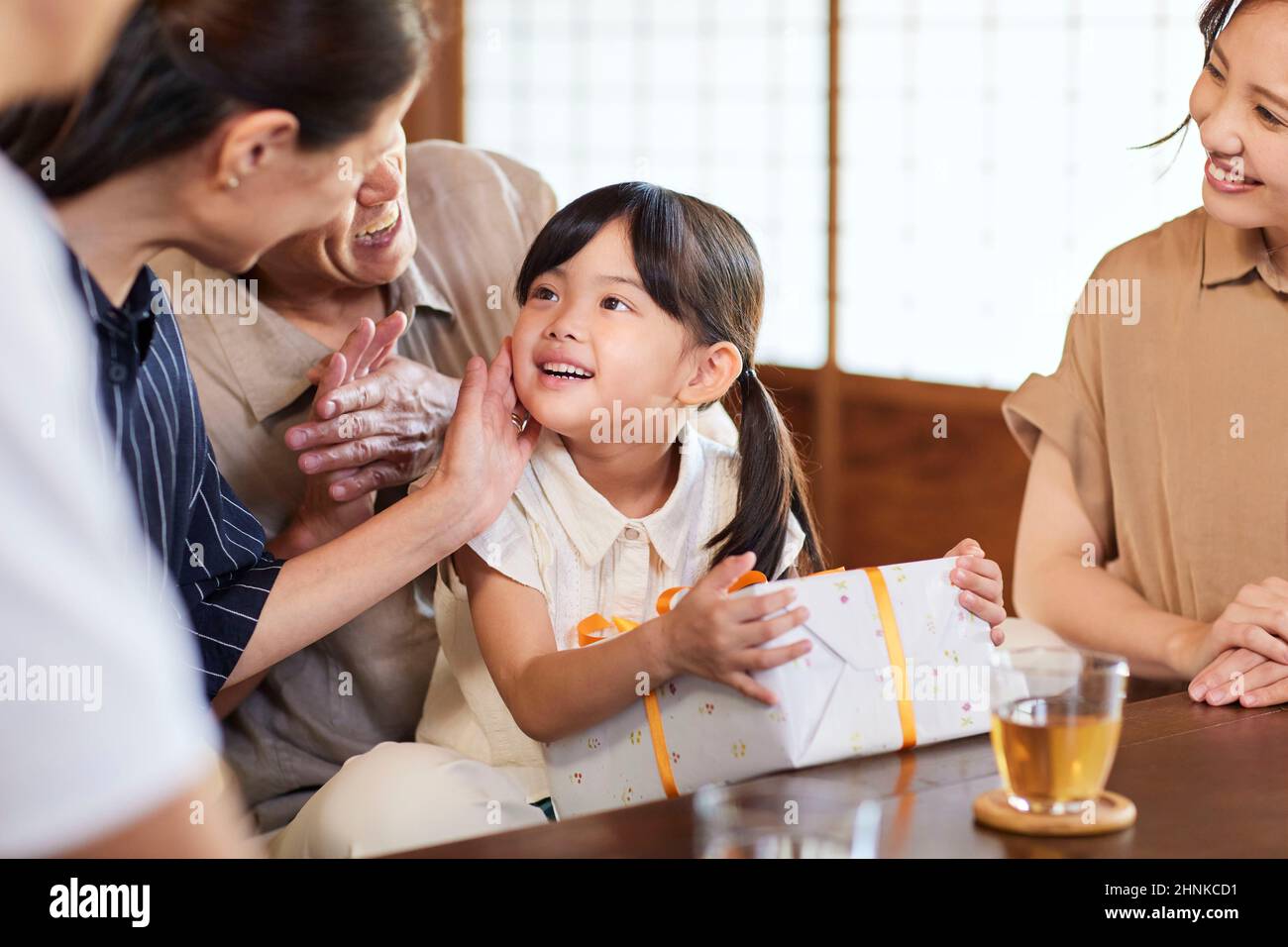 Japanese Girl Receiving A Present Stock Photo - Alamy