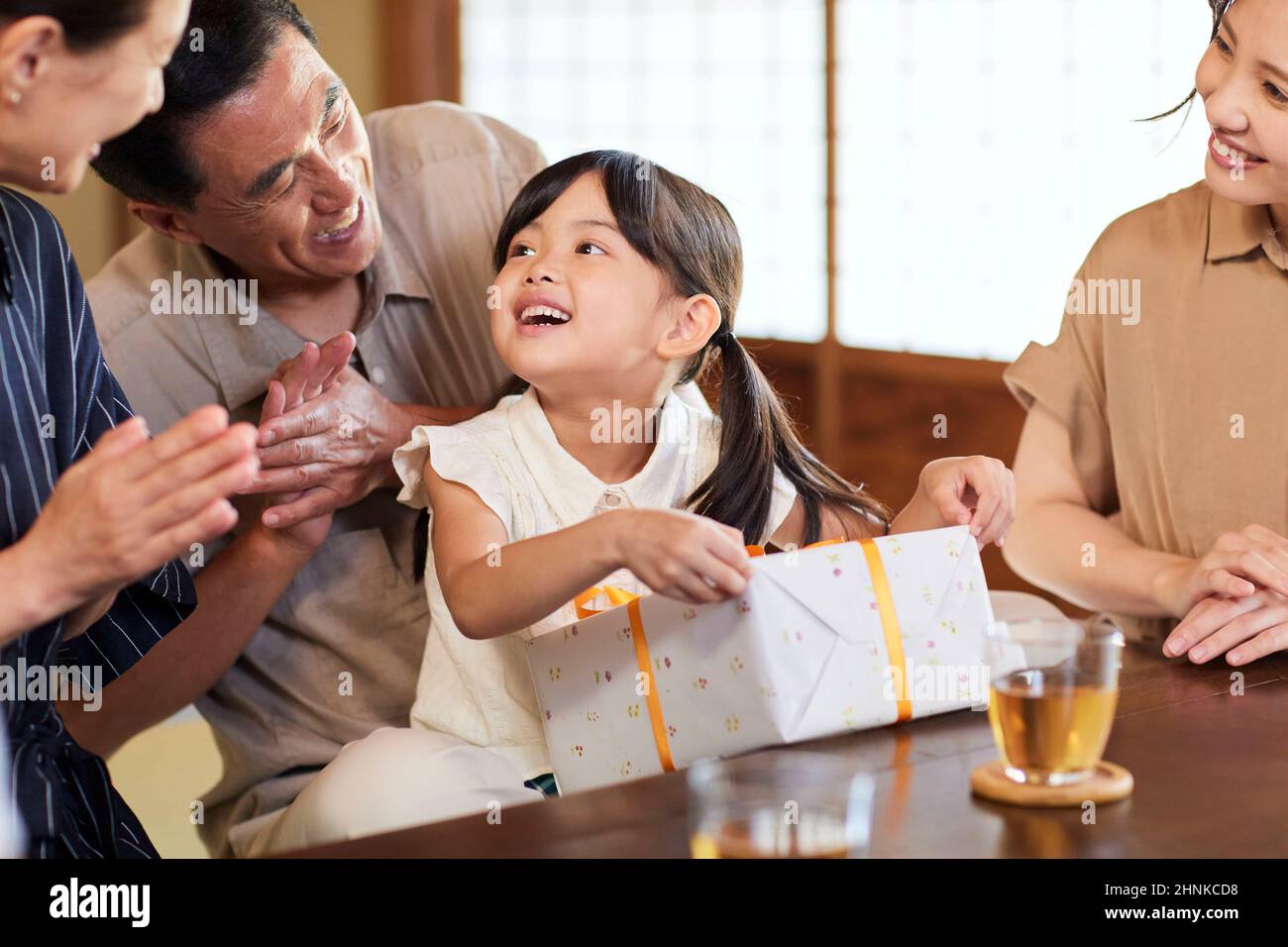 Japanese Girl Receiving A Present Stock Photo - Alamy