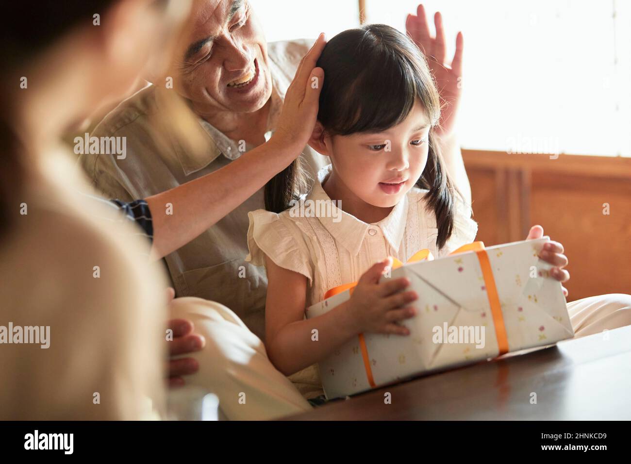 Japanese Girl Receiving A Present Stock Photo - Alamy