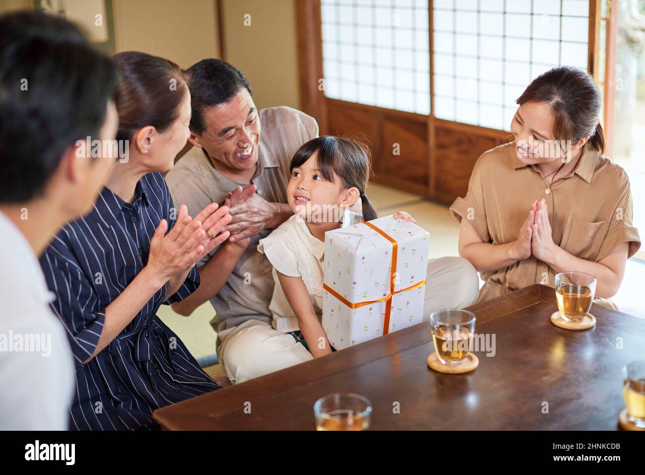 Japanese Girl Receiving A Present Stock Photo - Alamy