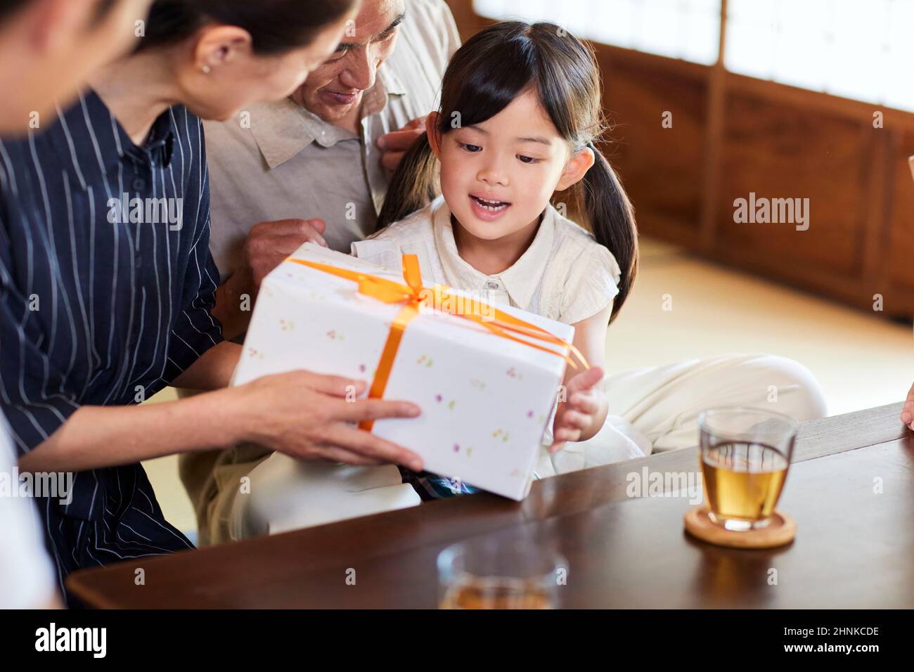 Japanese Girl Receiving A Present Stock Photo - Alamy