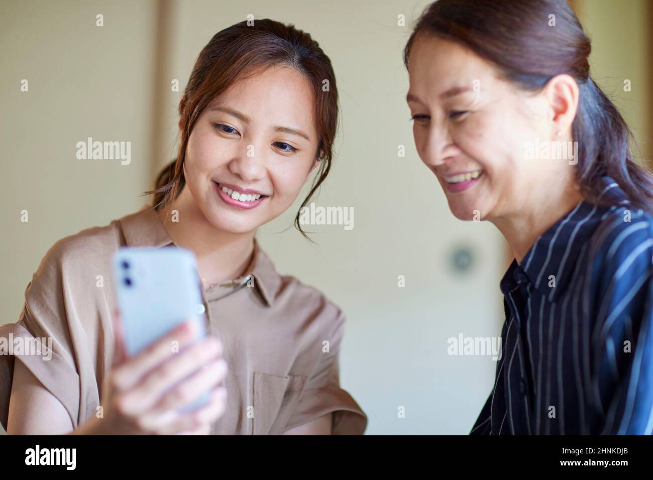 Japanese Senior Lady Who Teaches Me How To Use Smartphone Stock Photo ...