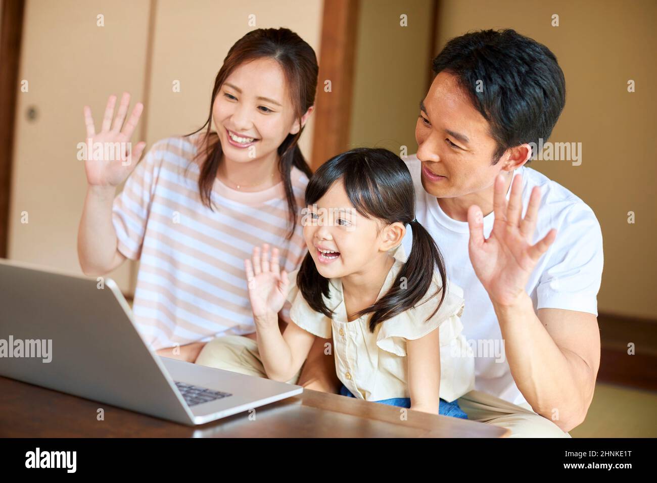 Japanese Parent And Child Making A Video Call Stock Photo - Alamy
