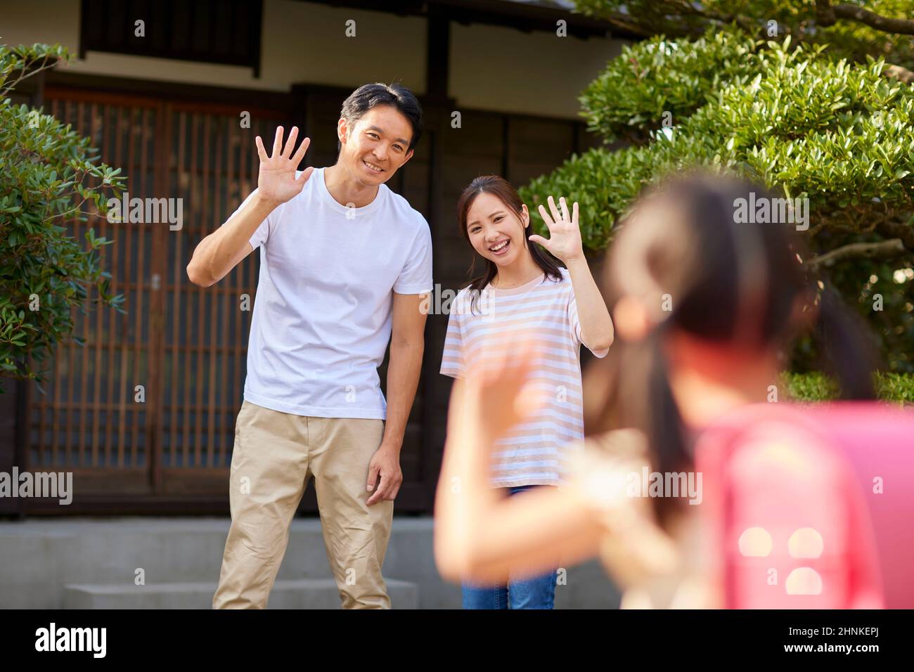 Japanese Couple Seeing Off Their Child Stock Photo - Alamy