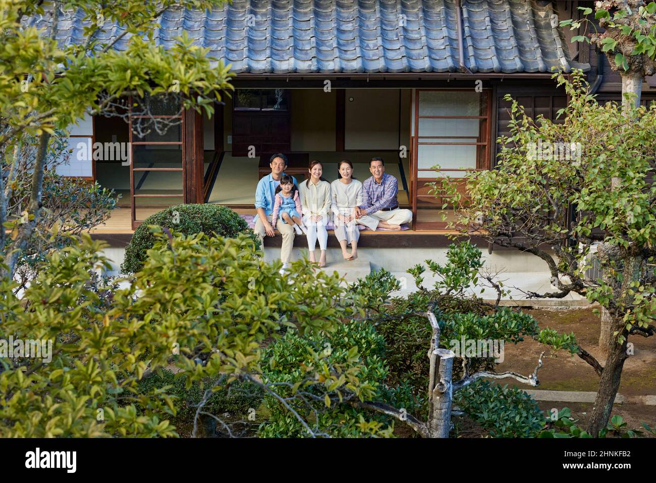 Three-Generations Japanese Family Sitting On The Porch Stock Photo - Alamy