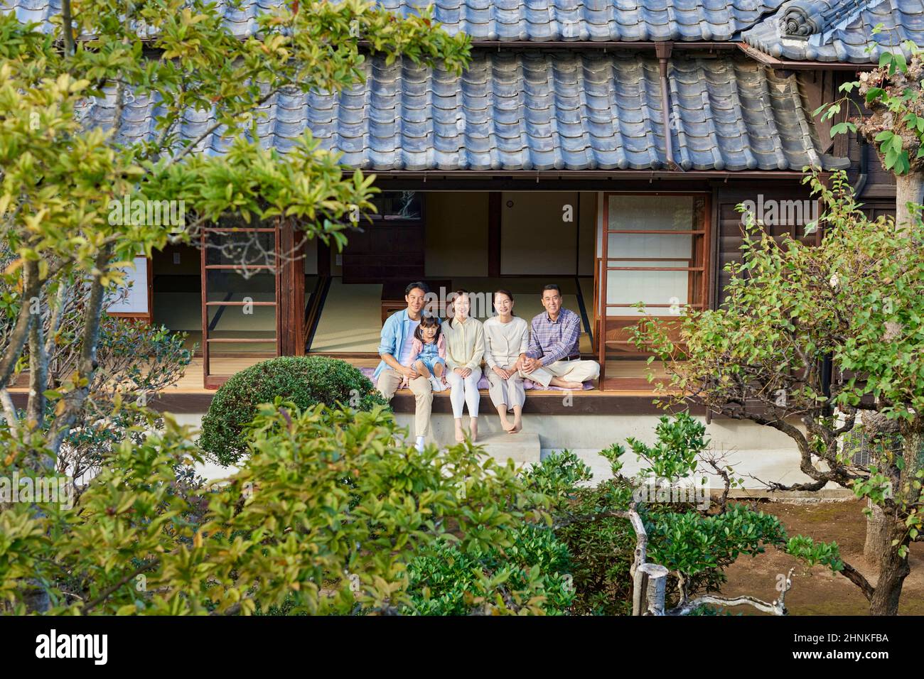 Three-Generations Japanese Family Sitting On The Porch Stock Photo - Alamy