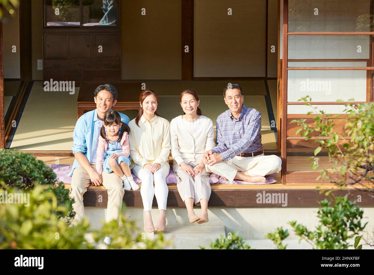 Three-Generations Japanese Family Sitting On The Porch Stock Photo - Alamy