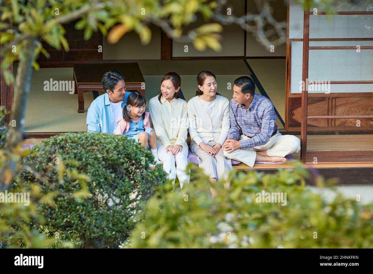Three-Generations Japanese Family Sitting On The Porch Stock Photo - Alamy