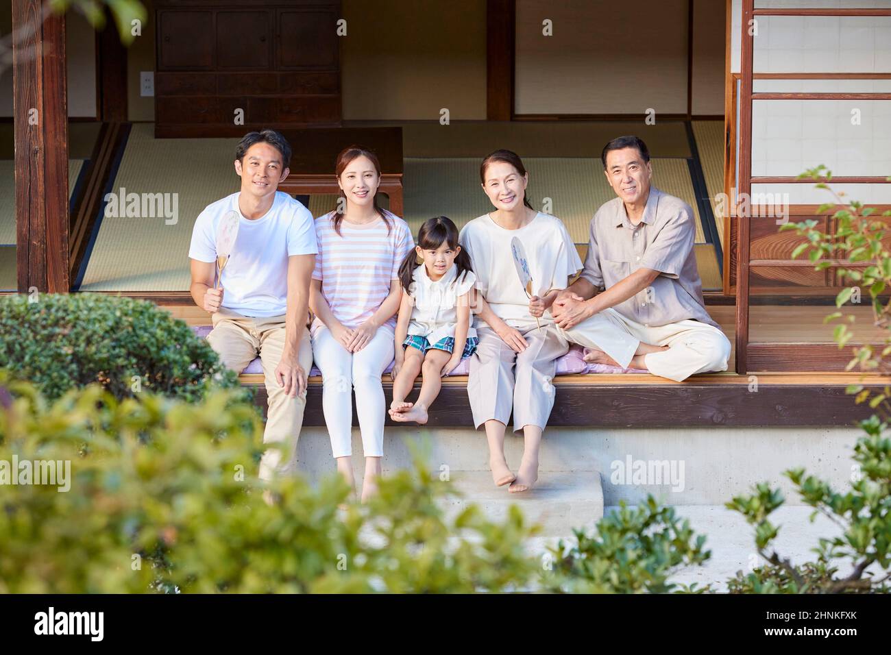 Three-Generations Japanese Family Sitting On The Porch Stock Photo - Alamy