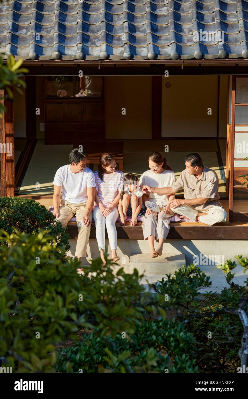 Three-Generations Japanese Family Sitting On The Porch Stock Photo - Alamy