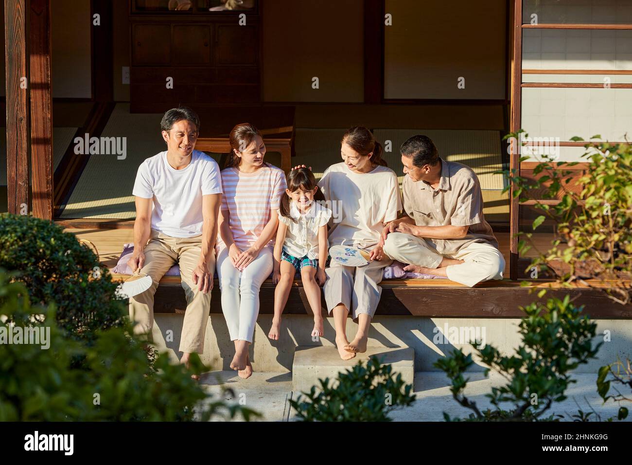 Three-Generations Japanese Family Sitting On The Porch Stock Photo - Alamy