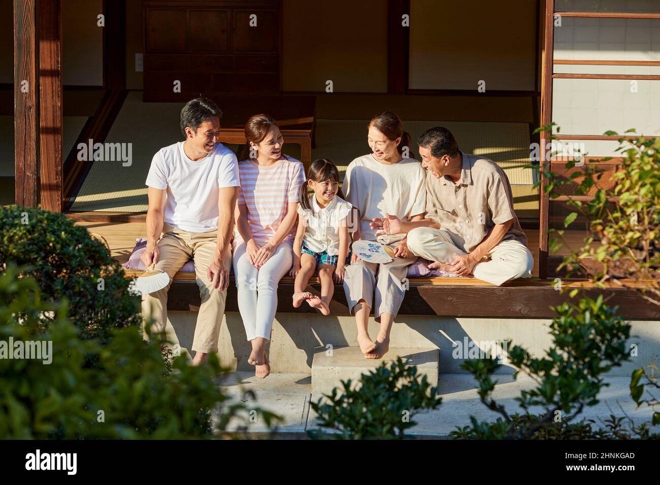 Three-Generations Japanese Family Sitting On The Porch Stock Photo - Alamy