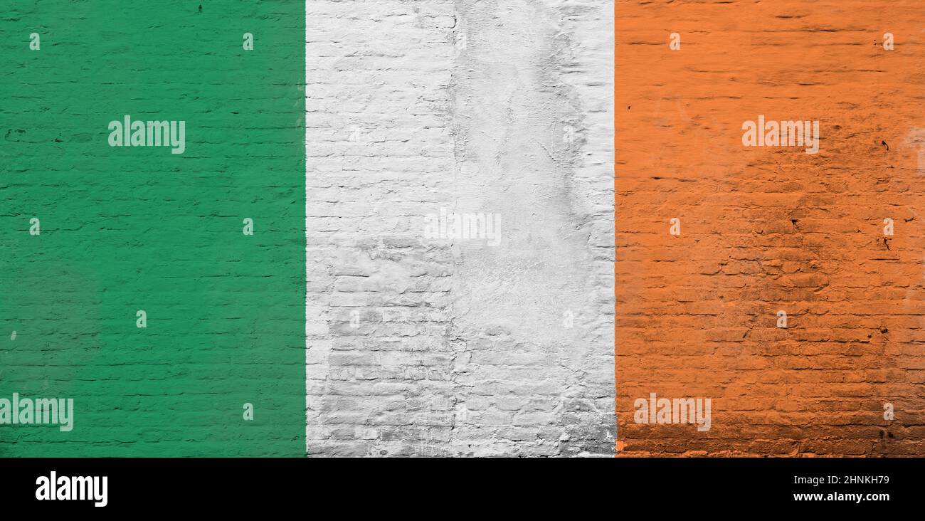 Full frame photo of a weathered flag of Ireland painted on a plastered ...