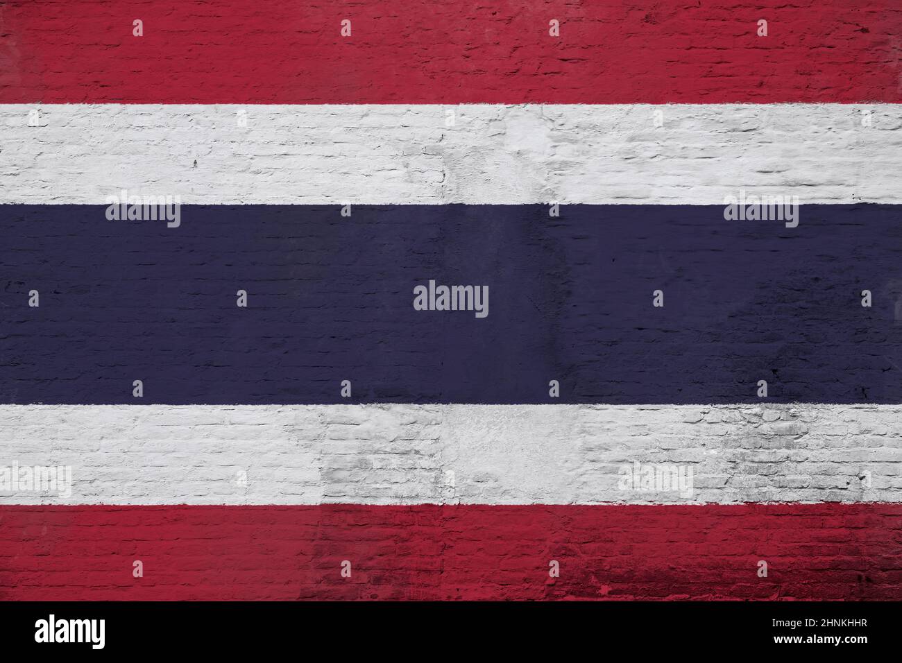 Full frame photo of a weathered flag of Thailand painted on a plastered ...