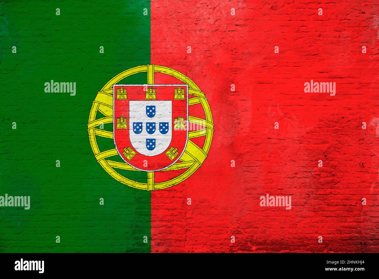 Full frame photo of a weathered flag of Portugal painted on a plastered ...