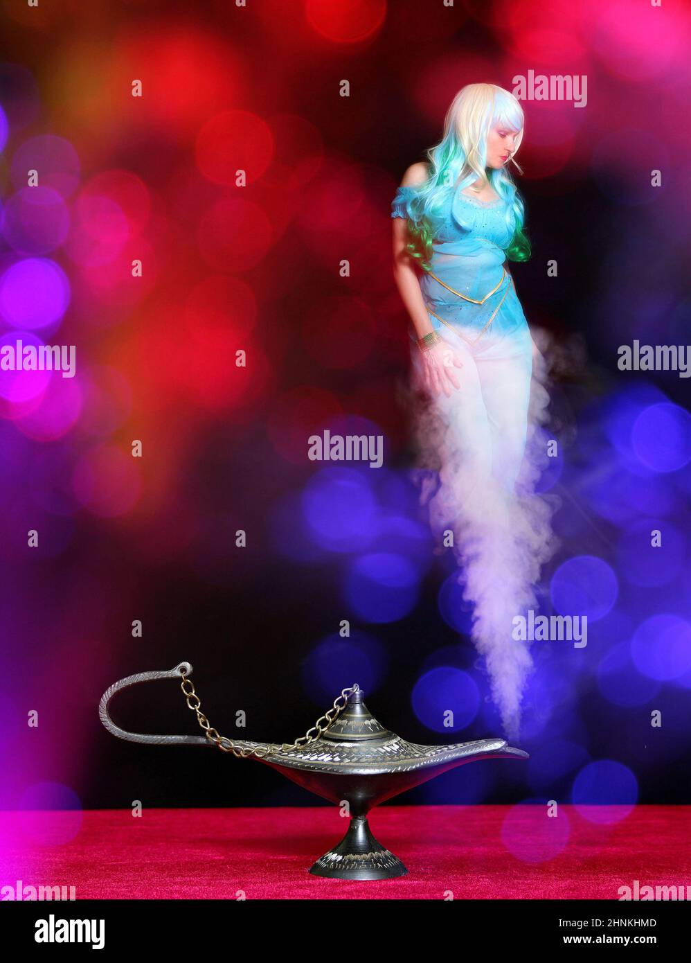 Aladdin's Lamp with Female Genie and Colorful Bokeh Stock Photo - Alamy