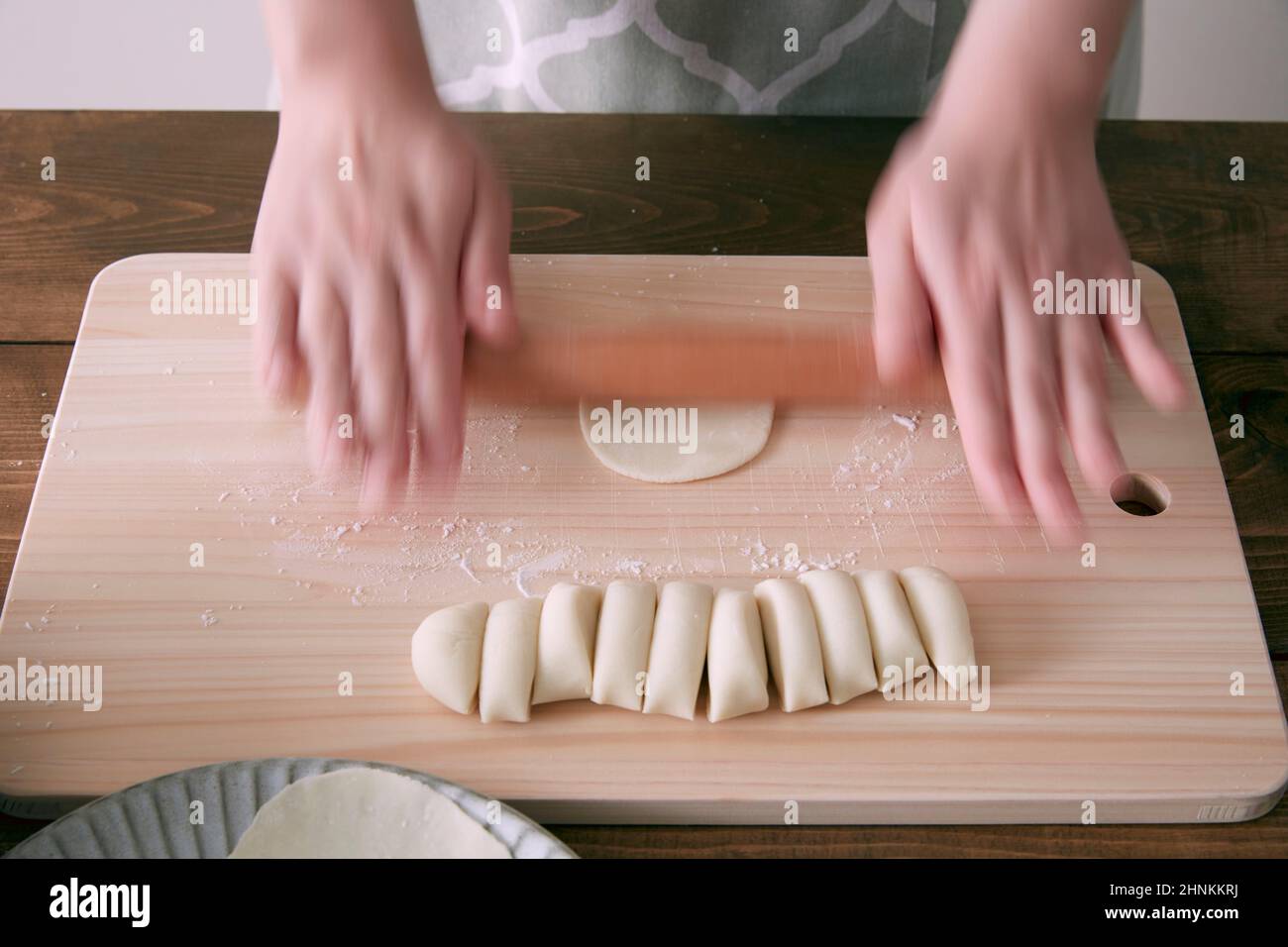 Woman rolling dough gyoza hi-res stock photography and images - Alamy