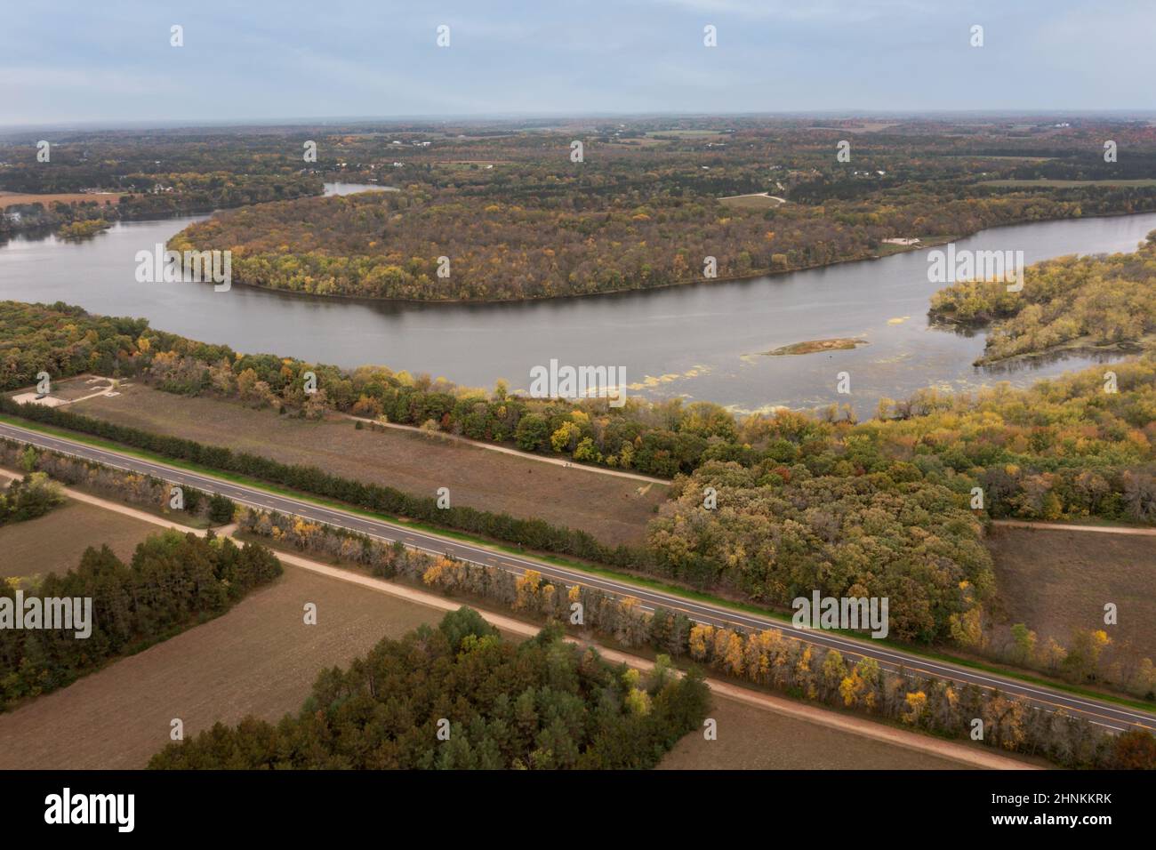 Road Travels Alongside River Through Forests and Fields in Minnesota ...