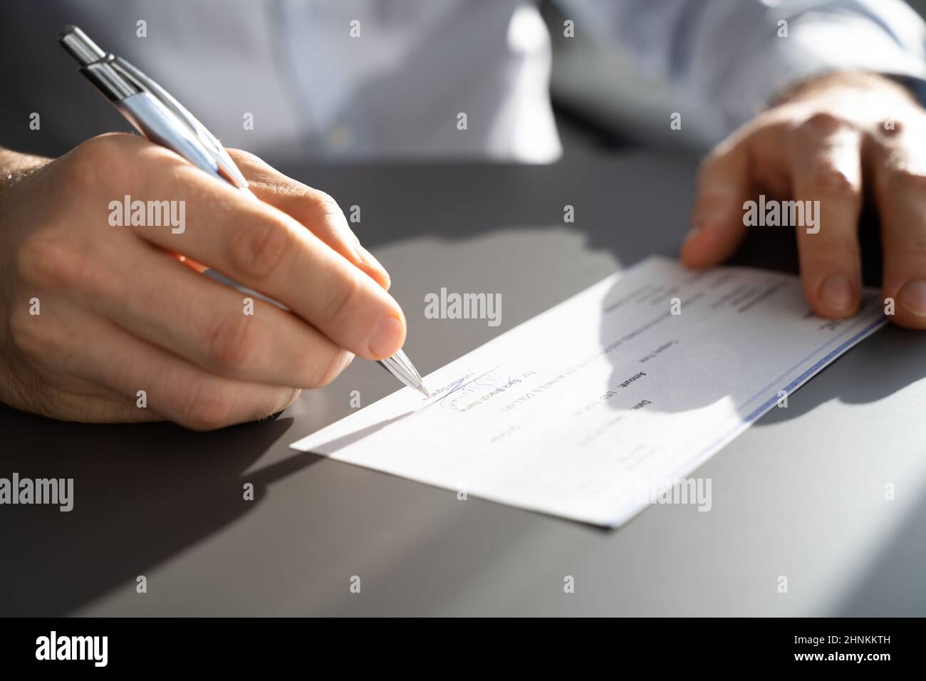 Hand writing cheque hi-res stock photography and images - Alamy
