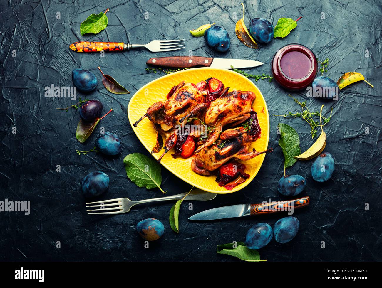 Fried quail in plum sauce.Meat with plum.Baked quail Stock Photo - Alamy