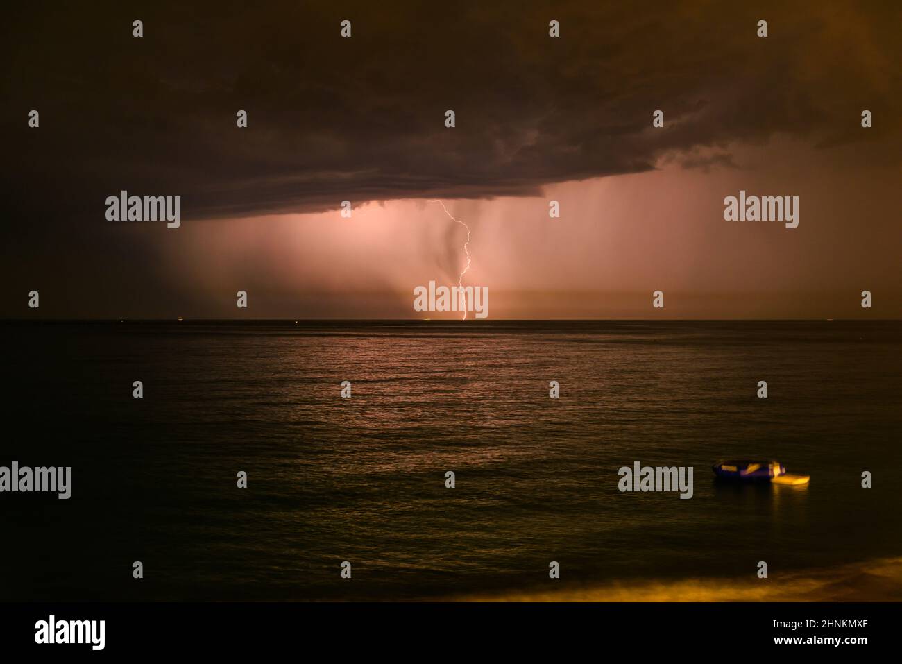 Lightning during a night thunderstorm on the summer ligurian sea Stock ...