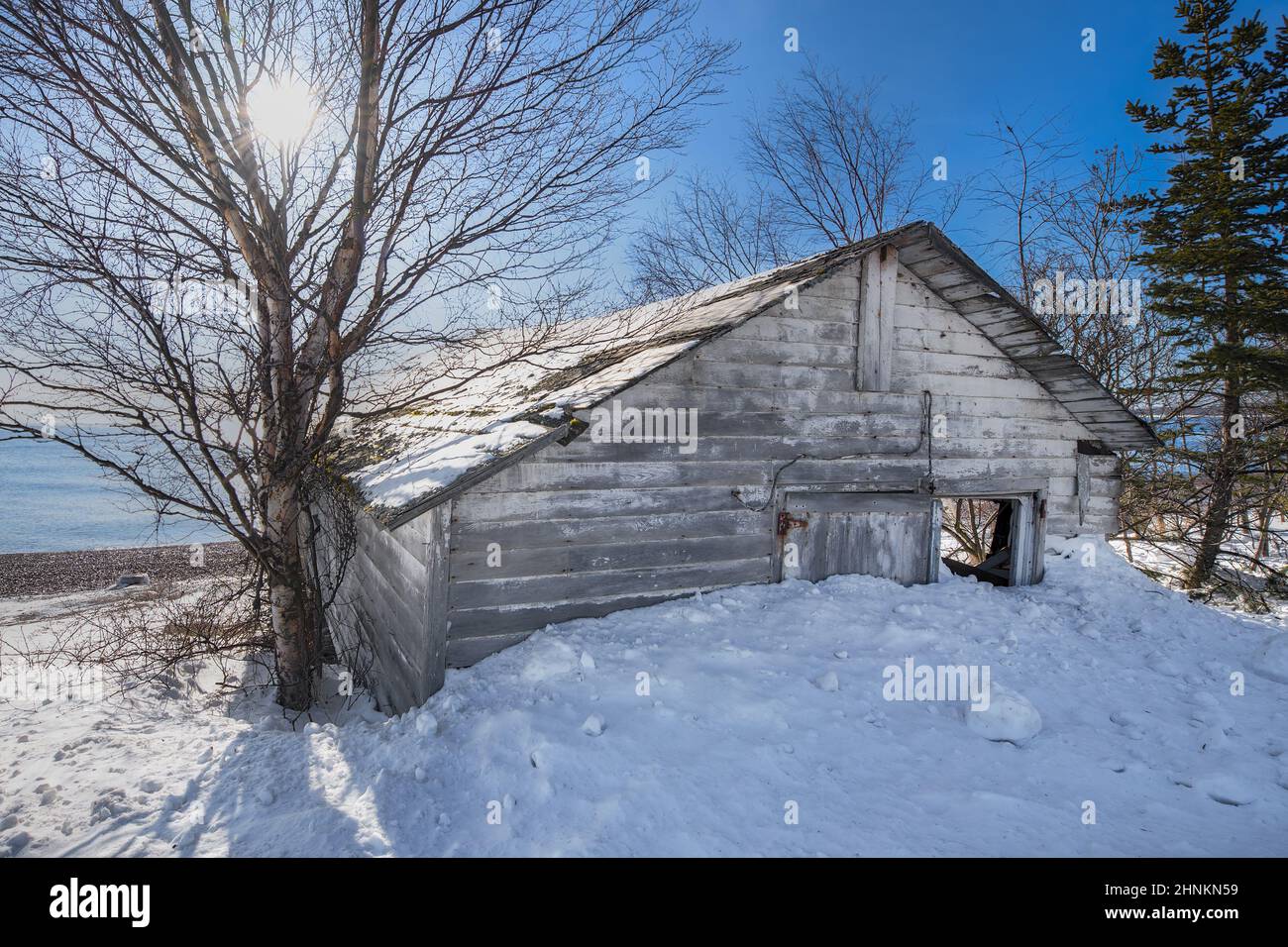Old Fishing Shack Along Shore of Lake Superior Winter Into the Sun ...