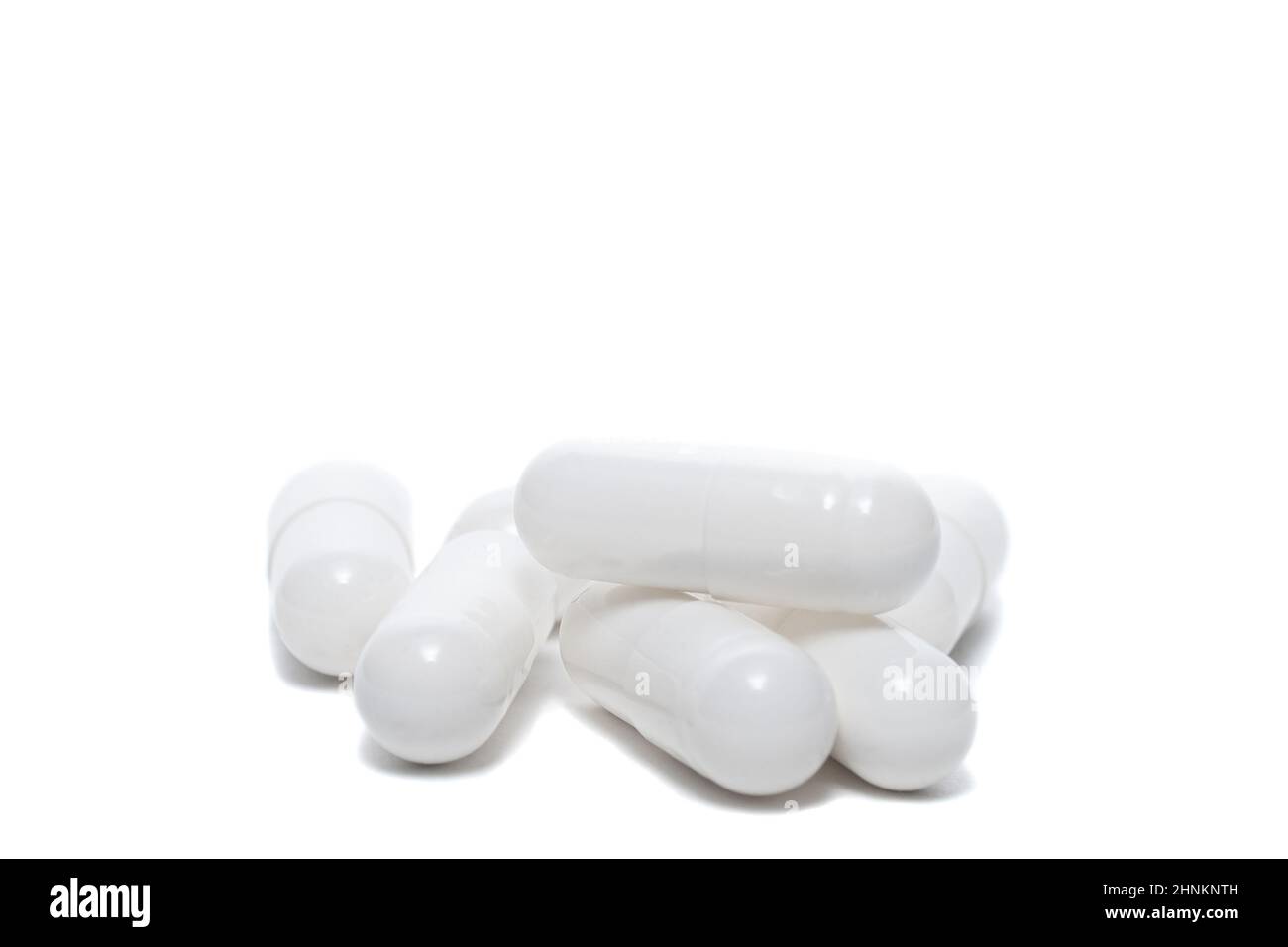 Tablet in capsule. Capsule pill on white background Stock Photo - Alamy