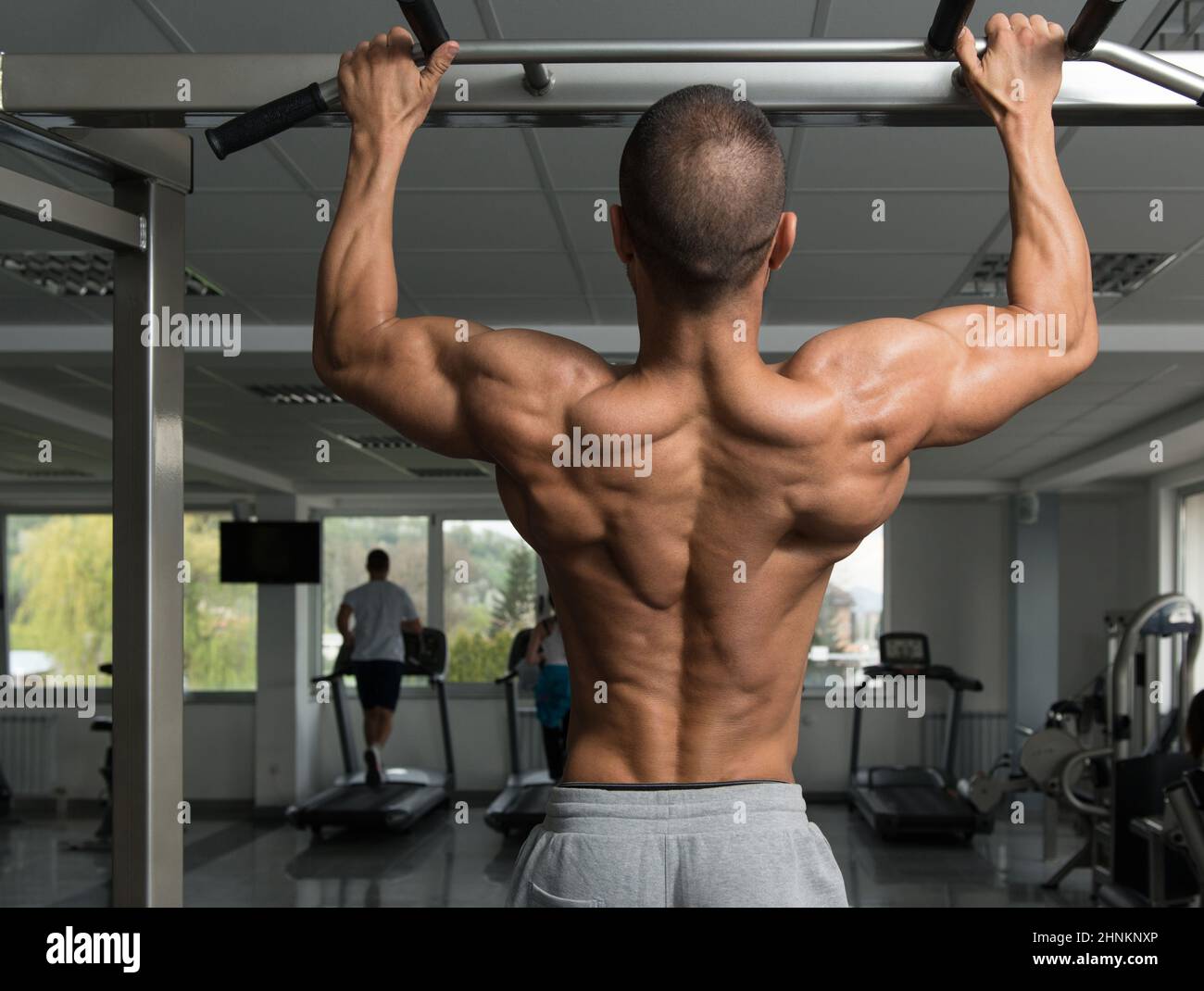 Male Athlete Doing Pull Ups Stock Photo - Alamy