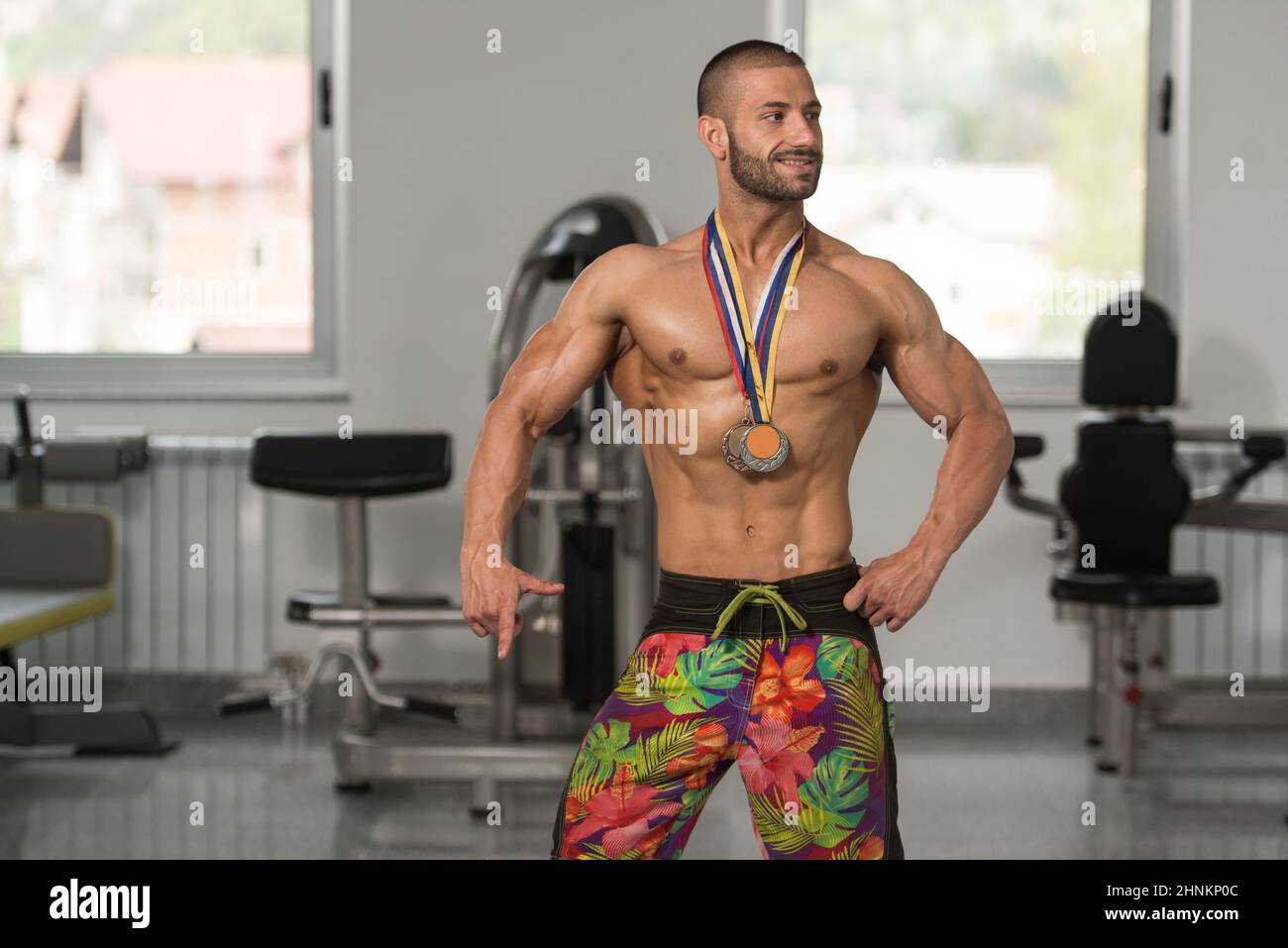 Male Fitness Competitor Showing His Winning Medal Stock Photo - Alamy