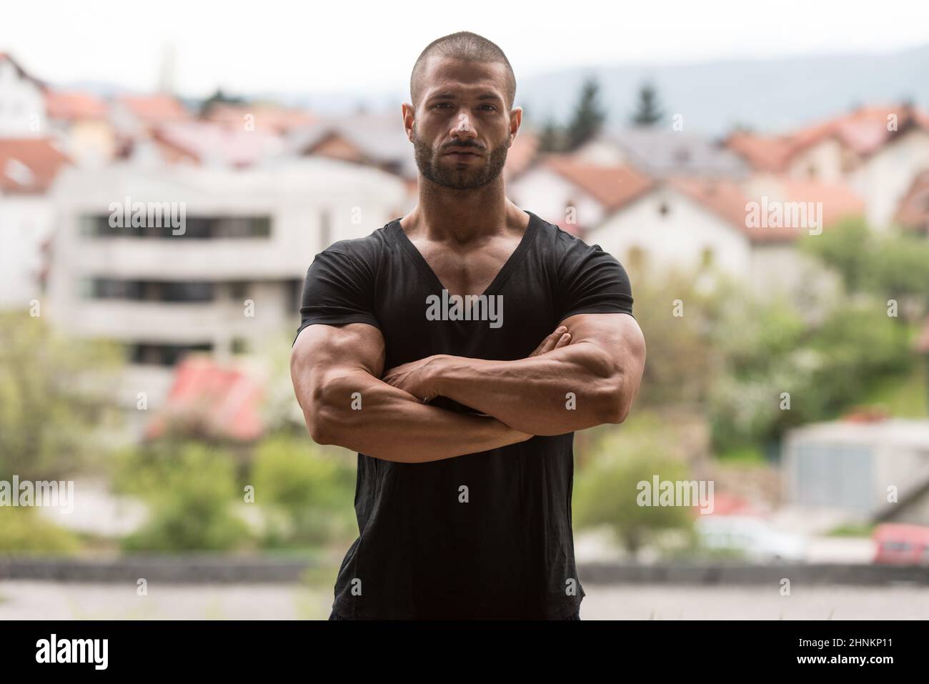 Strong Man Posing Outdoors Stock Photo - Alamy