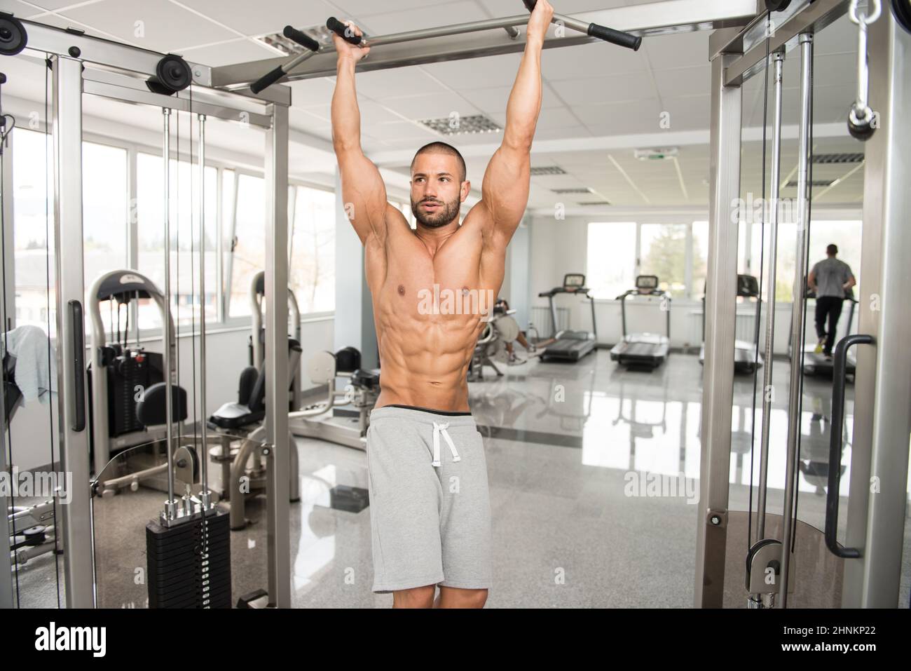 Model Performing Hanging Leg Raises Exercise Ab Exercises Stock Photo ...