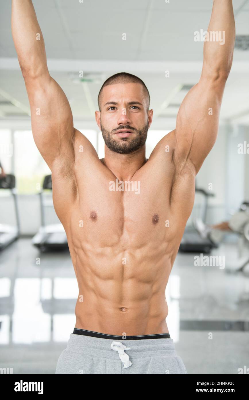 Man Performing Hanging Leg Raises Exercise Ab Exercises Stock Photo - Alamy