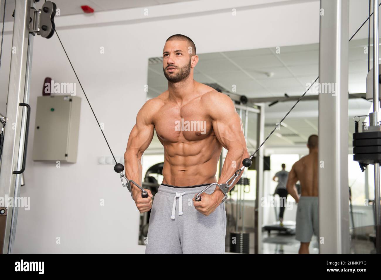 Muscular Man Exercising Chest Stock Photo - Alamy