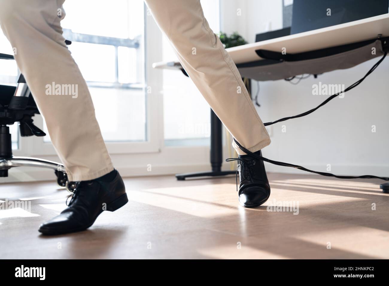 Stumble And Fall Over Wire In Office Stock Photo - Alamy