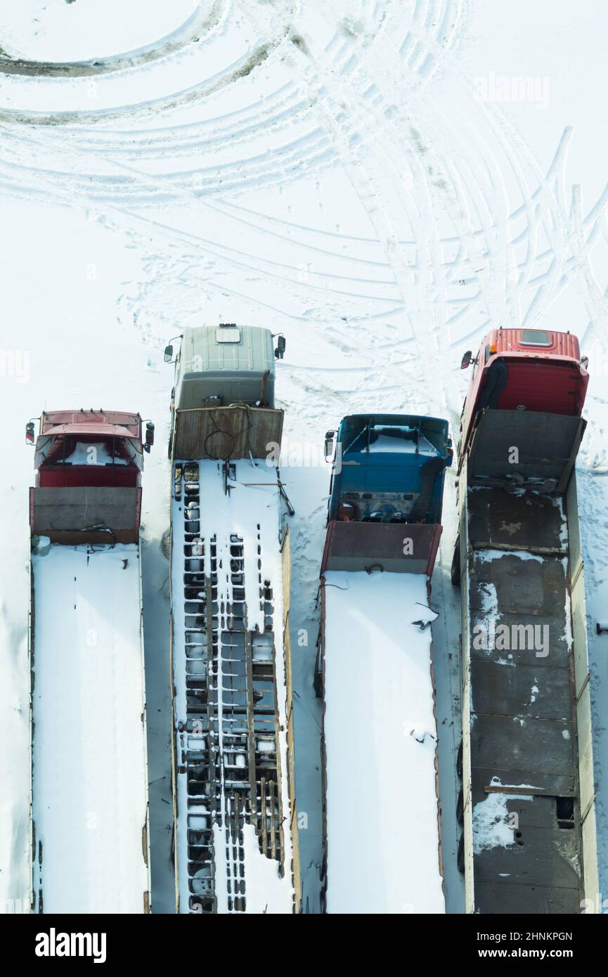 Truck under the snow. lorry covered with snow after snowfall. long ...