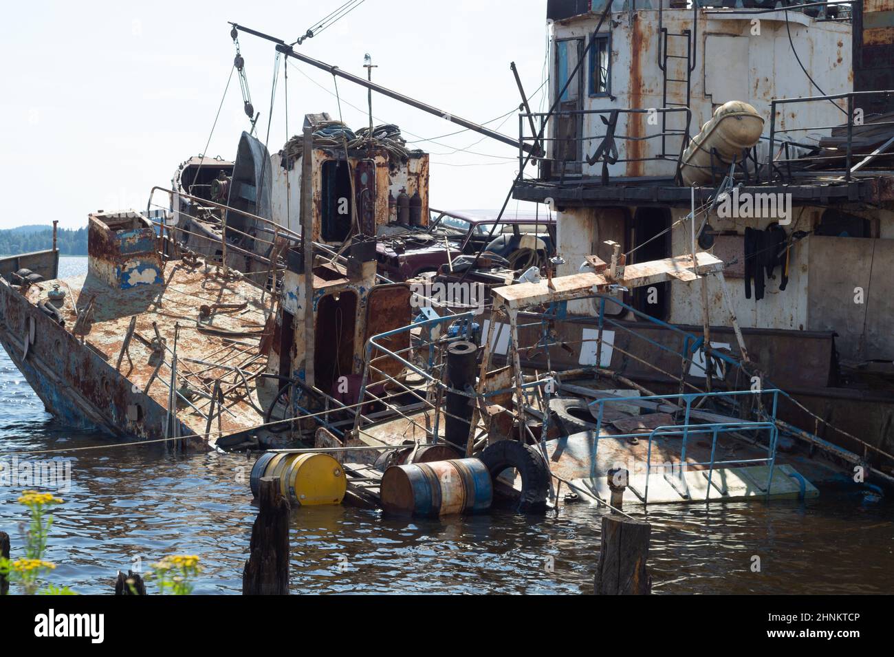 Abandoned rusty ship. sunken boat. floating barrels Stock Photo - Alamy